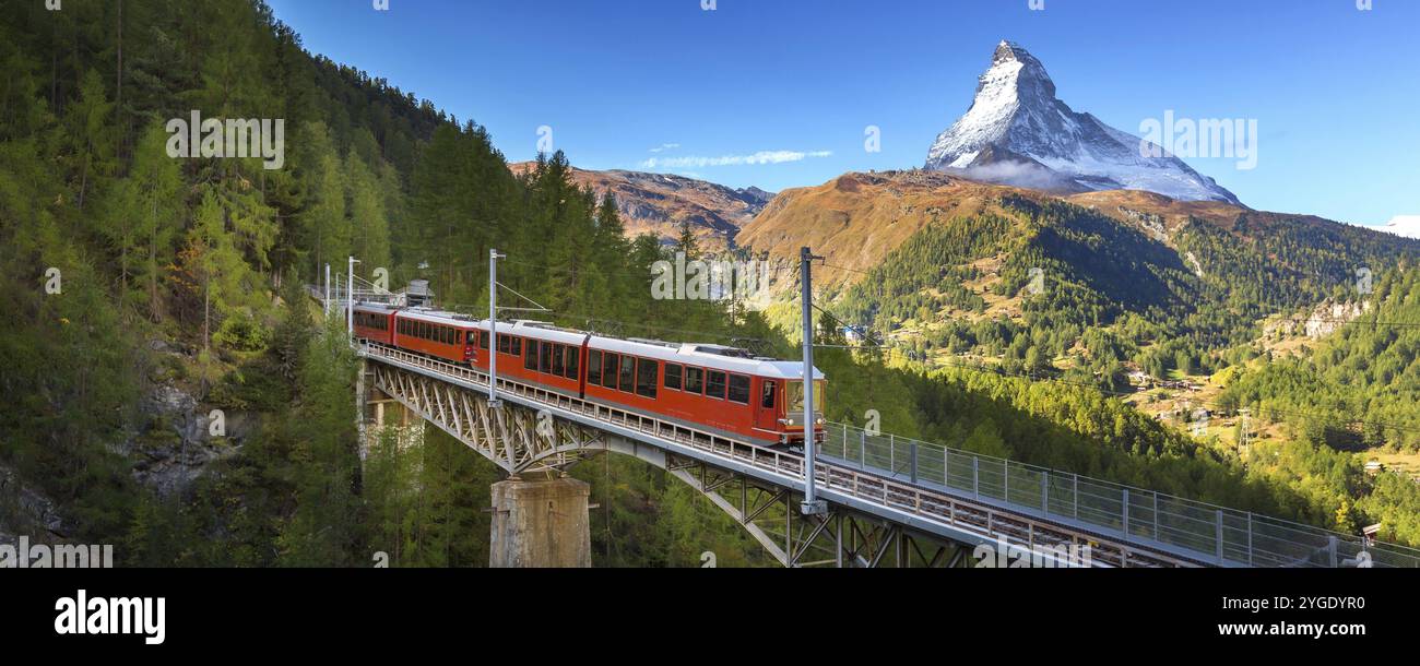Zermatt, Switzerland. Gornergrat red tourist train on the bridge and ...