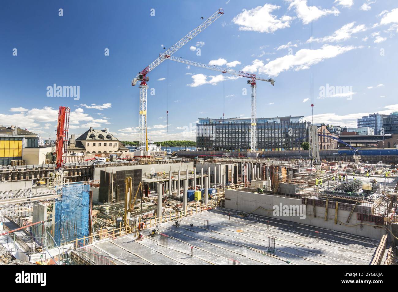 Horizontal shot of large construction site with foundations and cranes ...