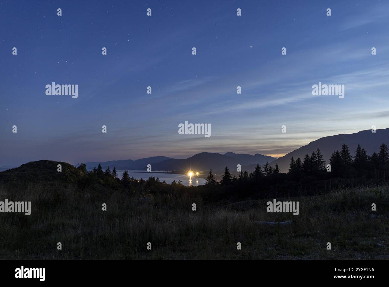 Evening scene over Loch Linnhe with lights from the opposite shore ...