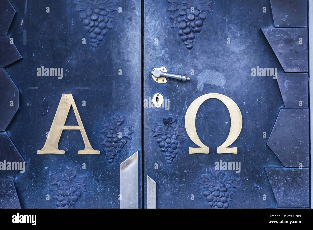 Alpha and Omega, relief with grapes, church gate of Kitzeck parish ...