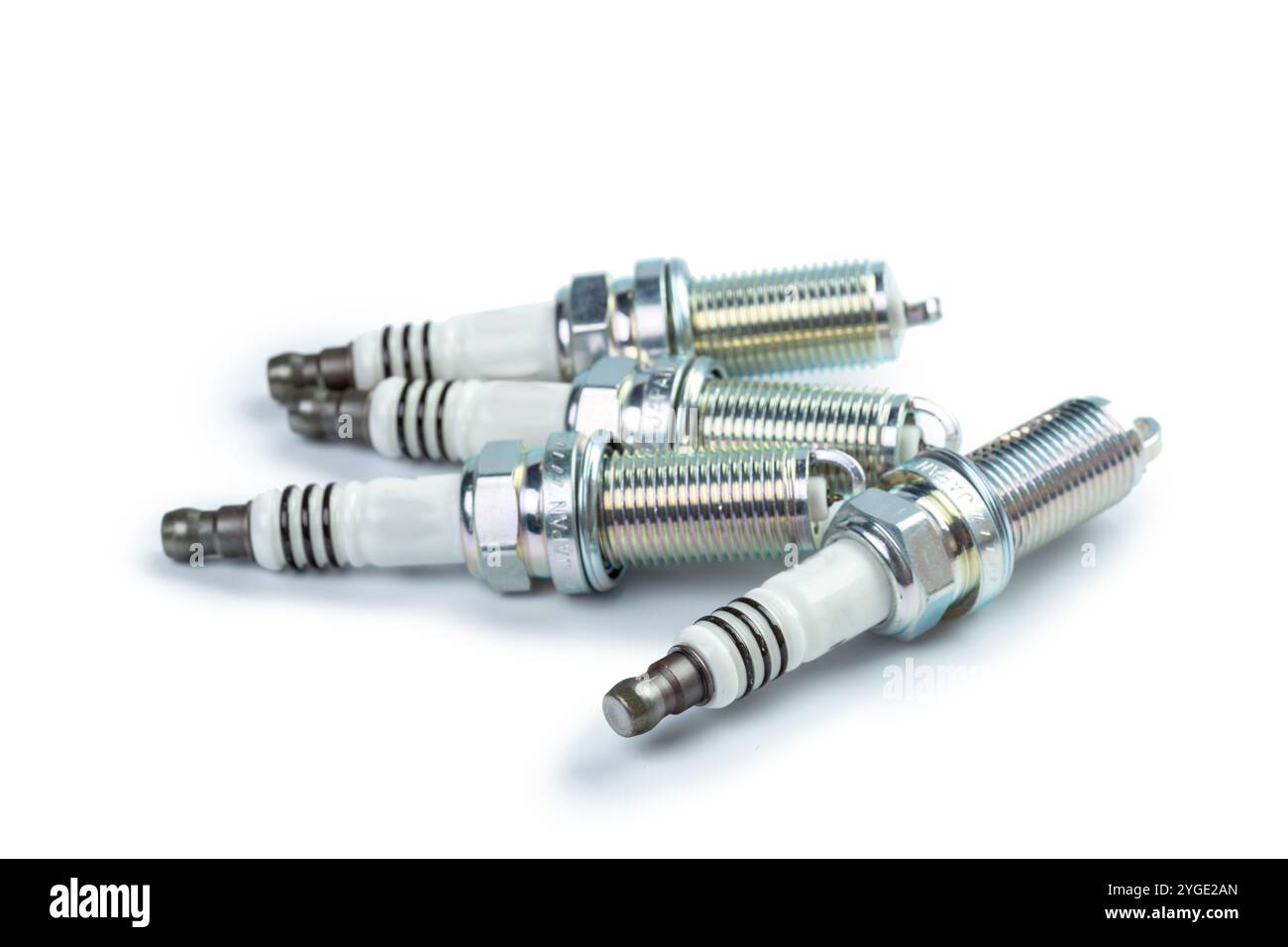 spark plugs isolated on white Stock Photo - Alamy