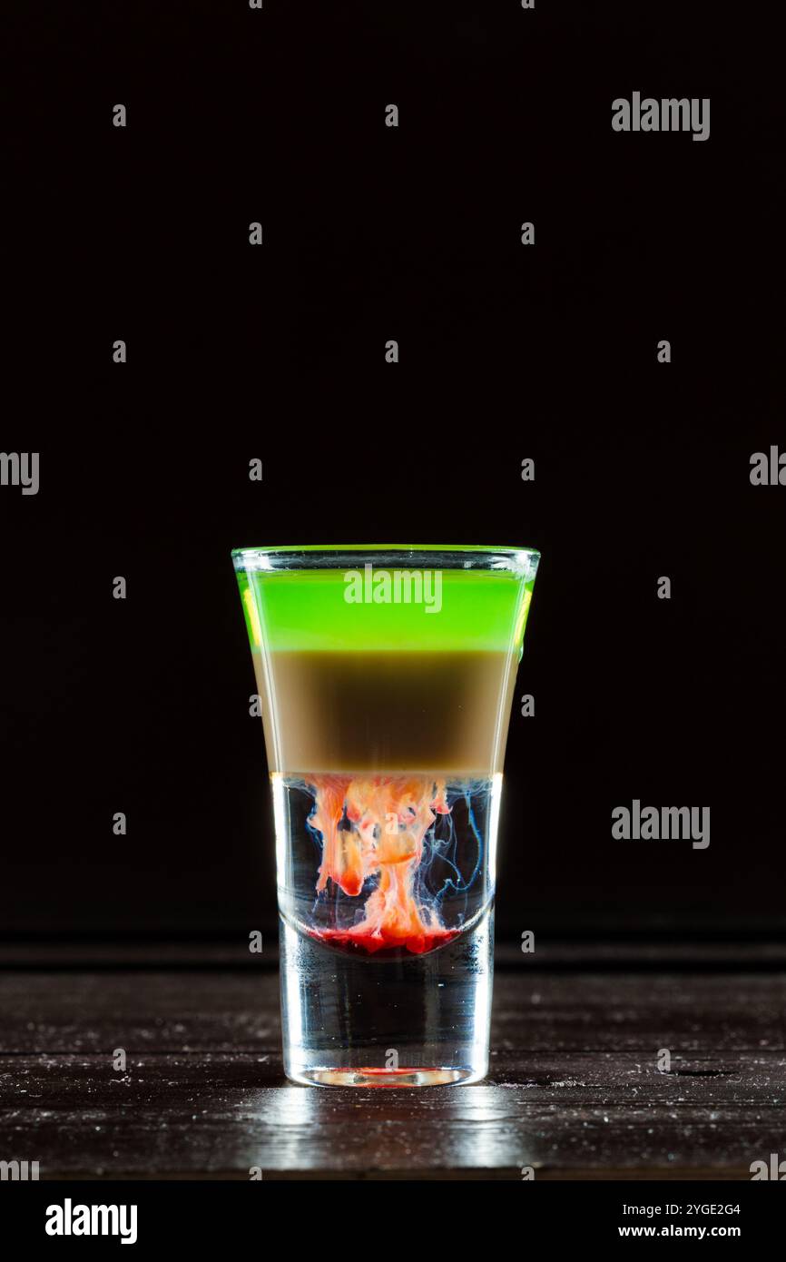 Colorful alcoholic cocktail in a shot glass Stock Photo - Alamy