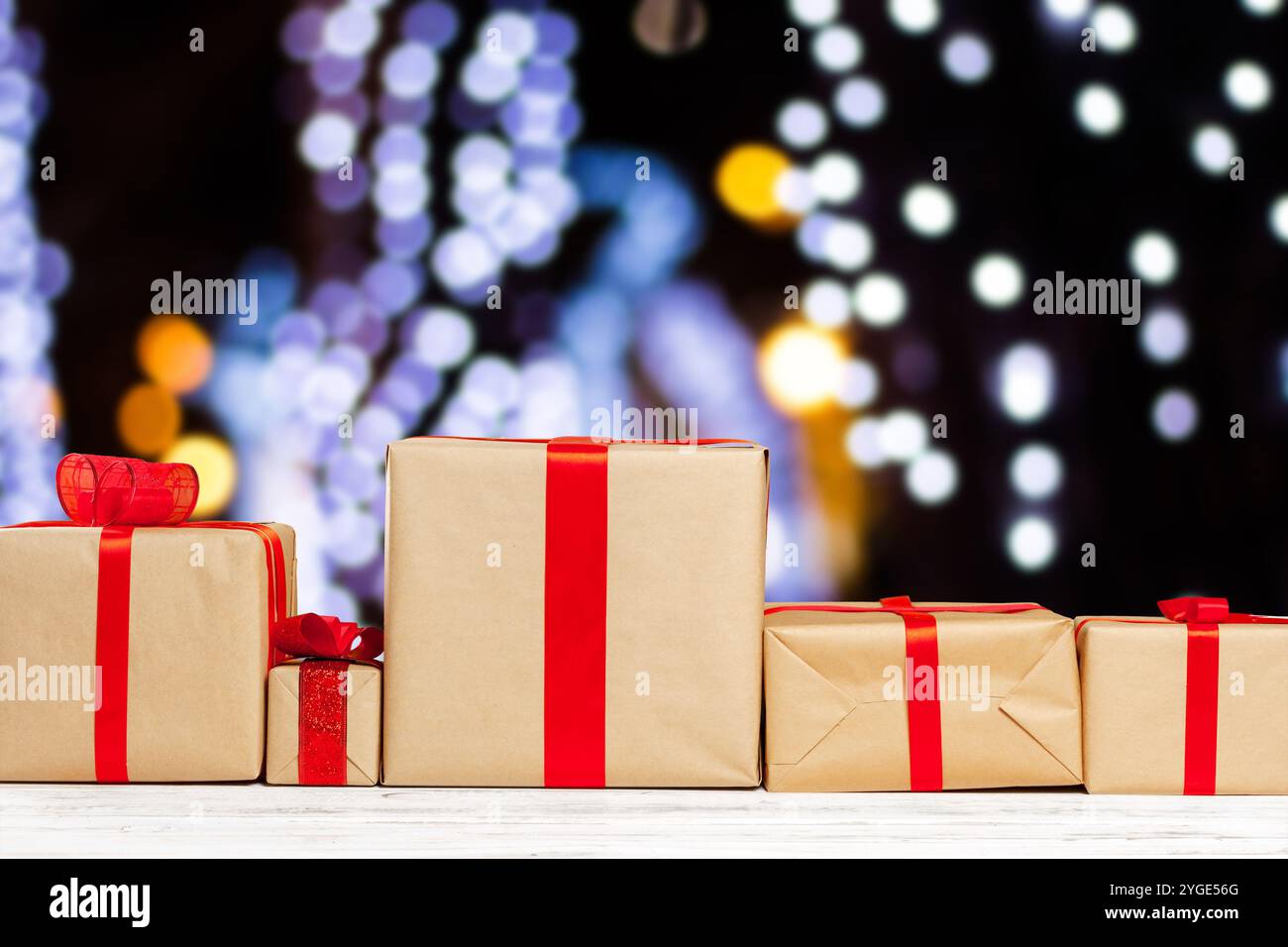 pile of gifts on the old table Stock Photo - Alamy