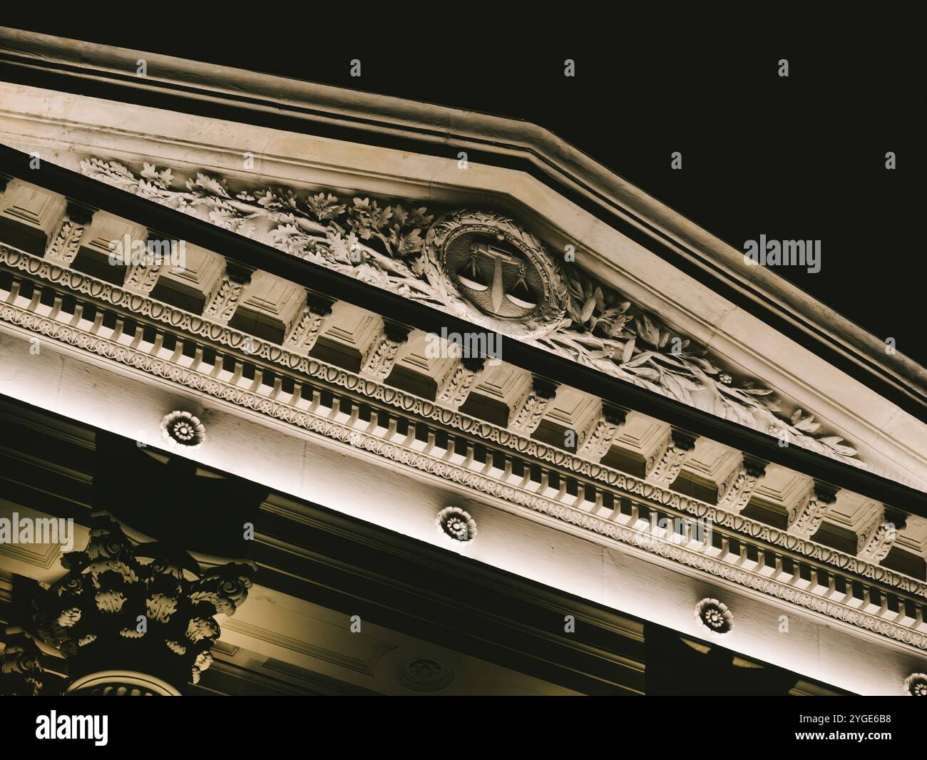 Intricate carvings and decorative elements adorn the top of a grand ...