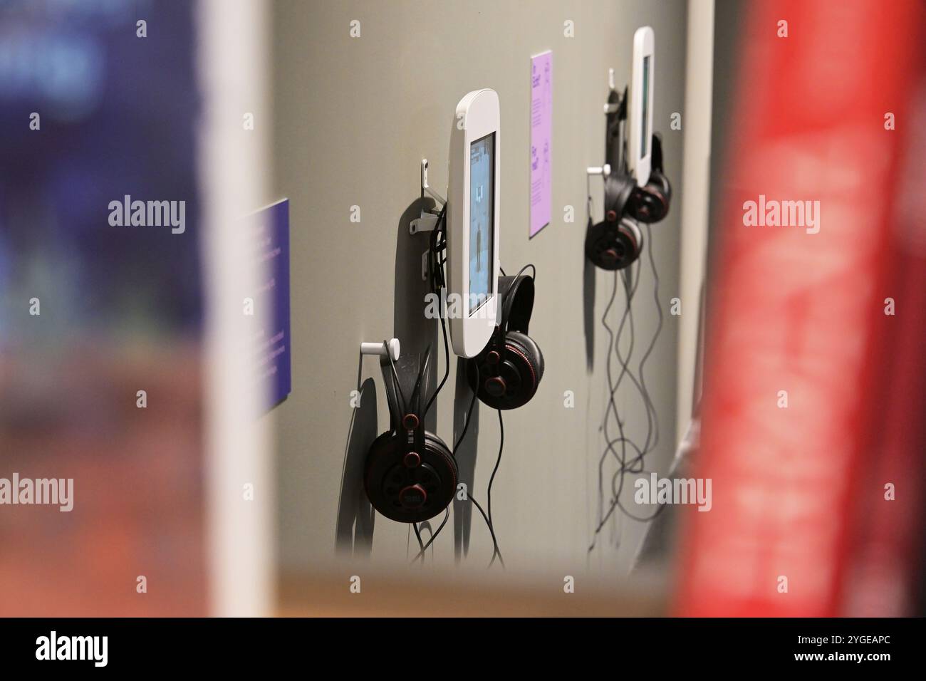 Potsdam, Germany. 07th Nov, 2024. Headphones are attached to cell phone ...