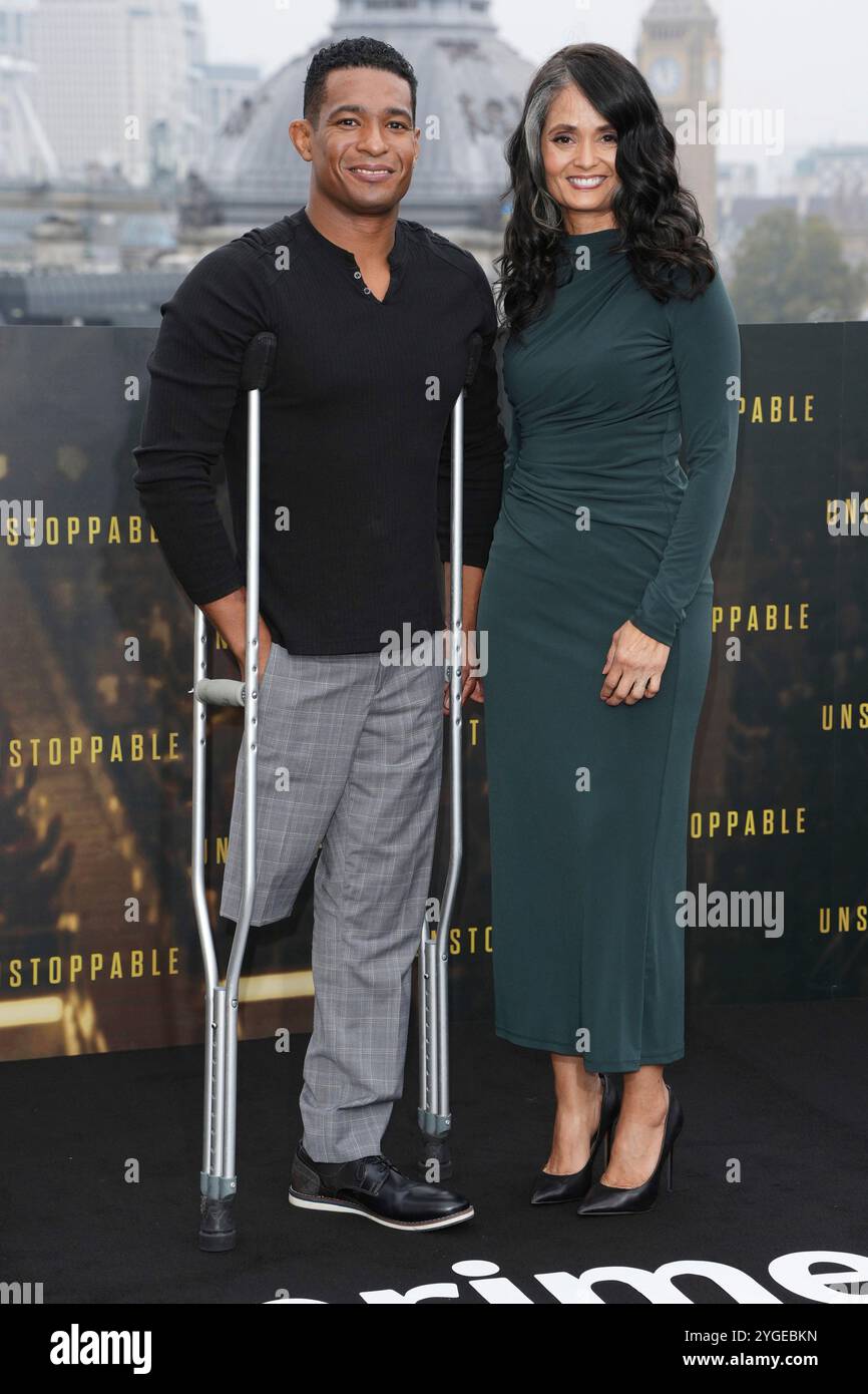 Judy Robles, from left, and Anthony Robles pose for photographers upon ...