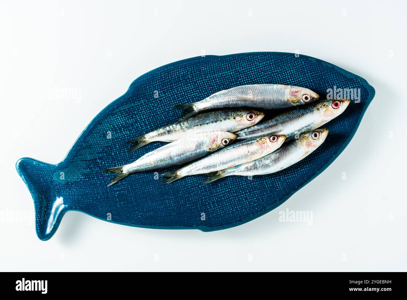 marinate fresh raw anchovies . close up. cooking recipe , fish market ...