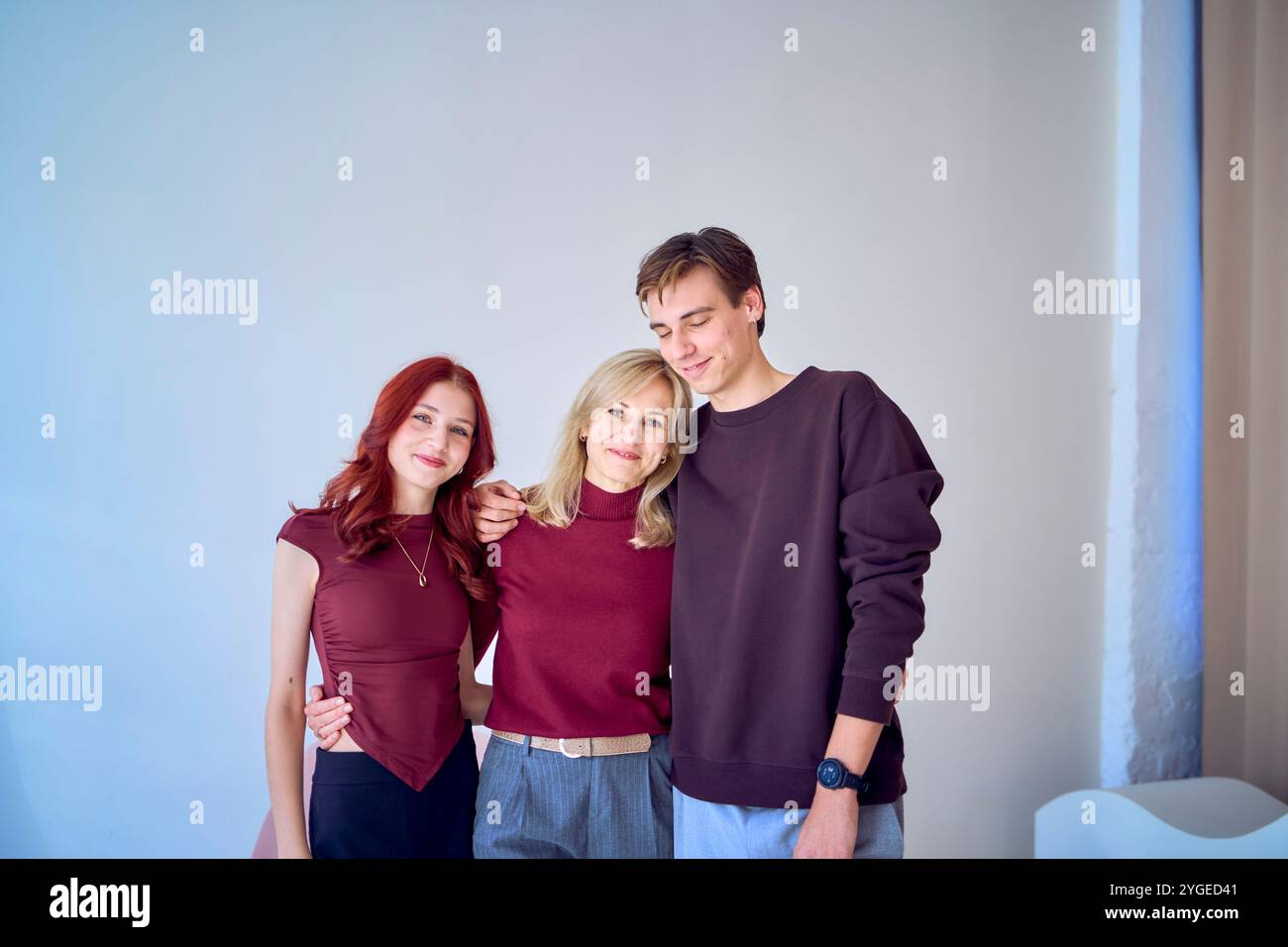 middle-aged mother hugs an adult son and a teenage daughter Stock Photo ...