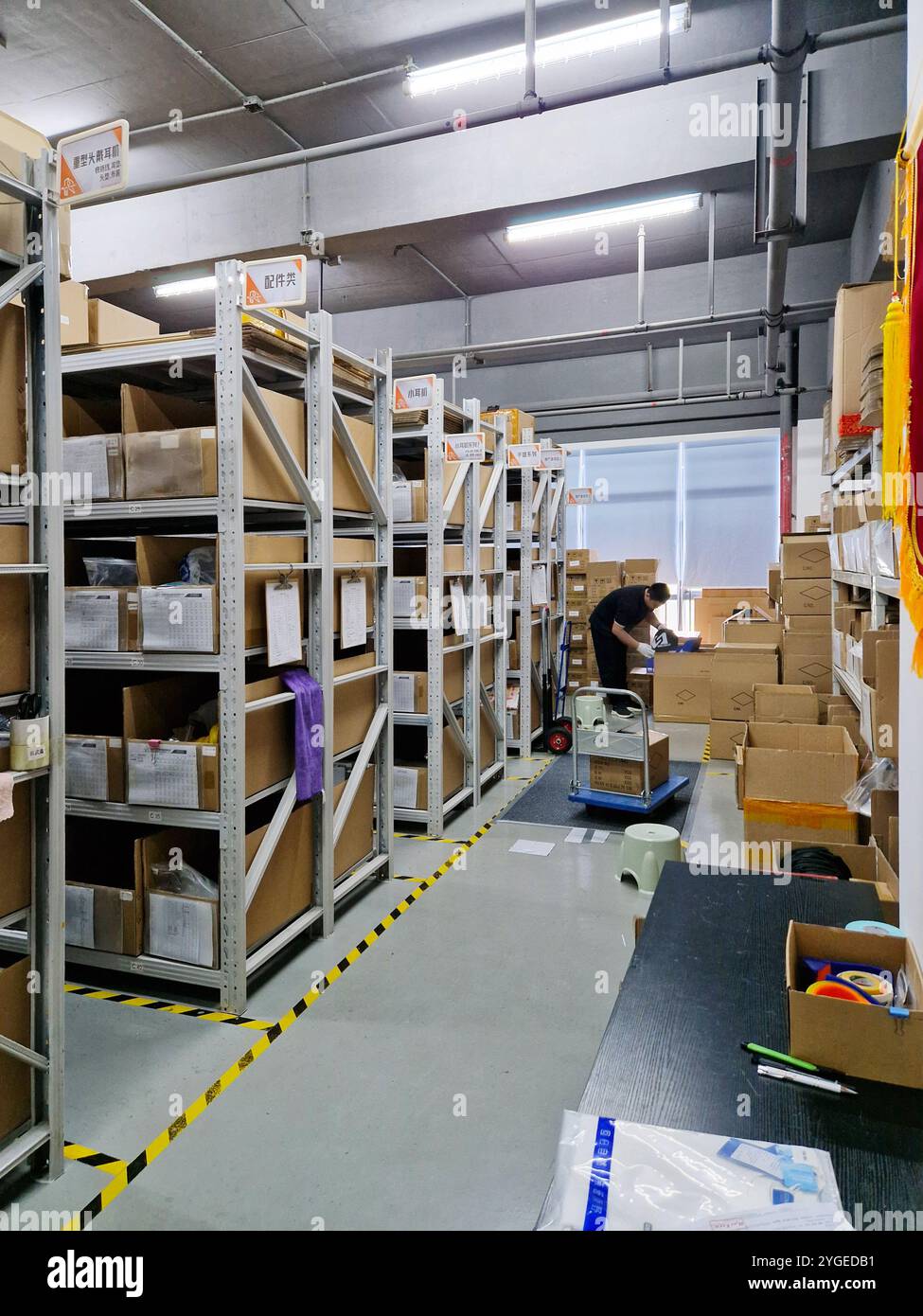Shenzhen, China - May 10, 2024: Interior of a well-organized warehouse ...