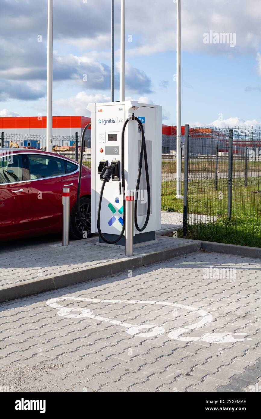 Red Tesla Model 3 Dual Motor at the lithuanian charging station Ignitis ...
