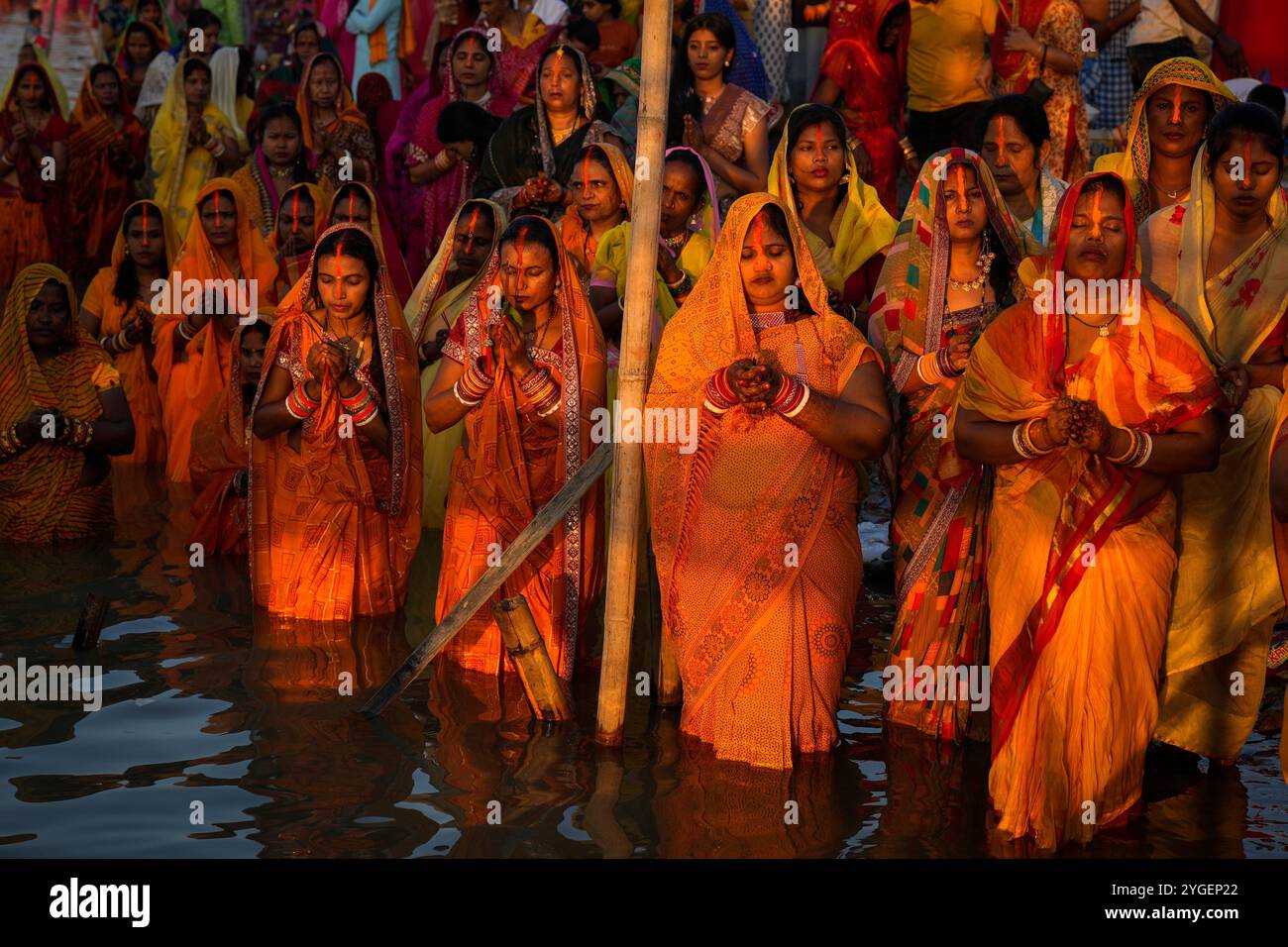 Hindu devotees gather by the river Brahmaputra and offer prayers during ...