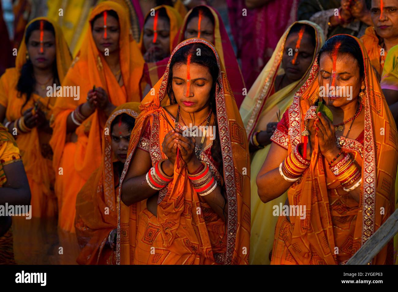 Hindu devotees gather by the river Brahmaputra and offer prayers during ...