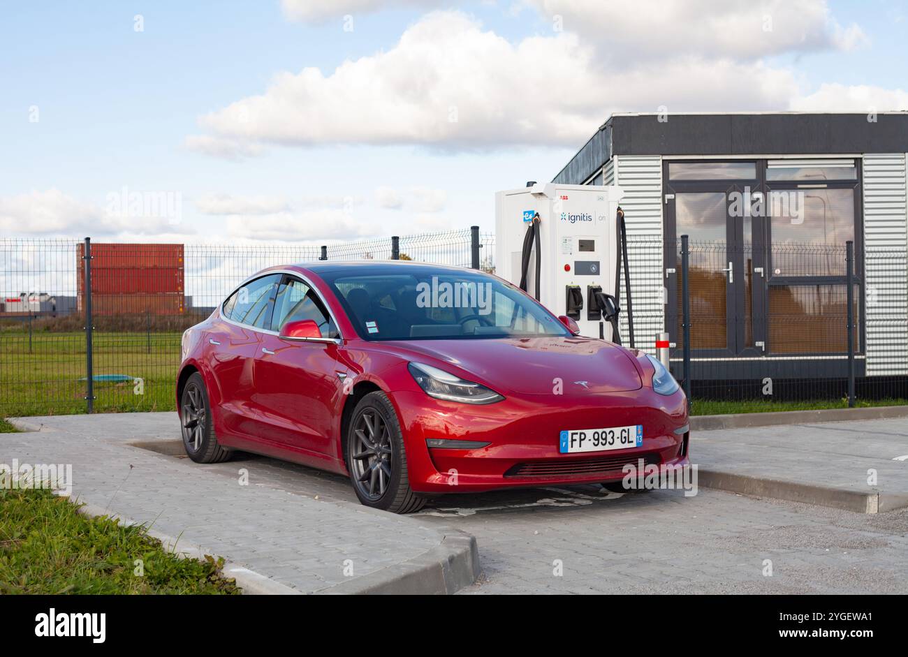 Red full electric american car Tesla Model 3 Dual Motor has fast ...