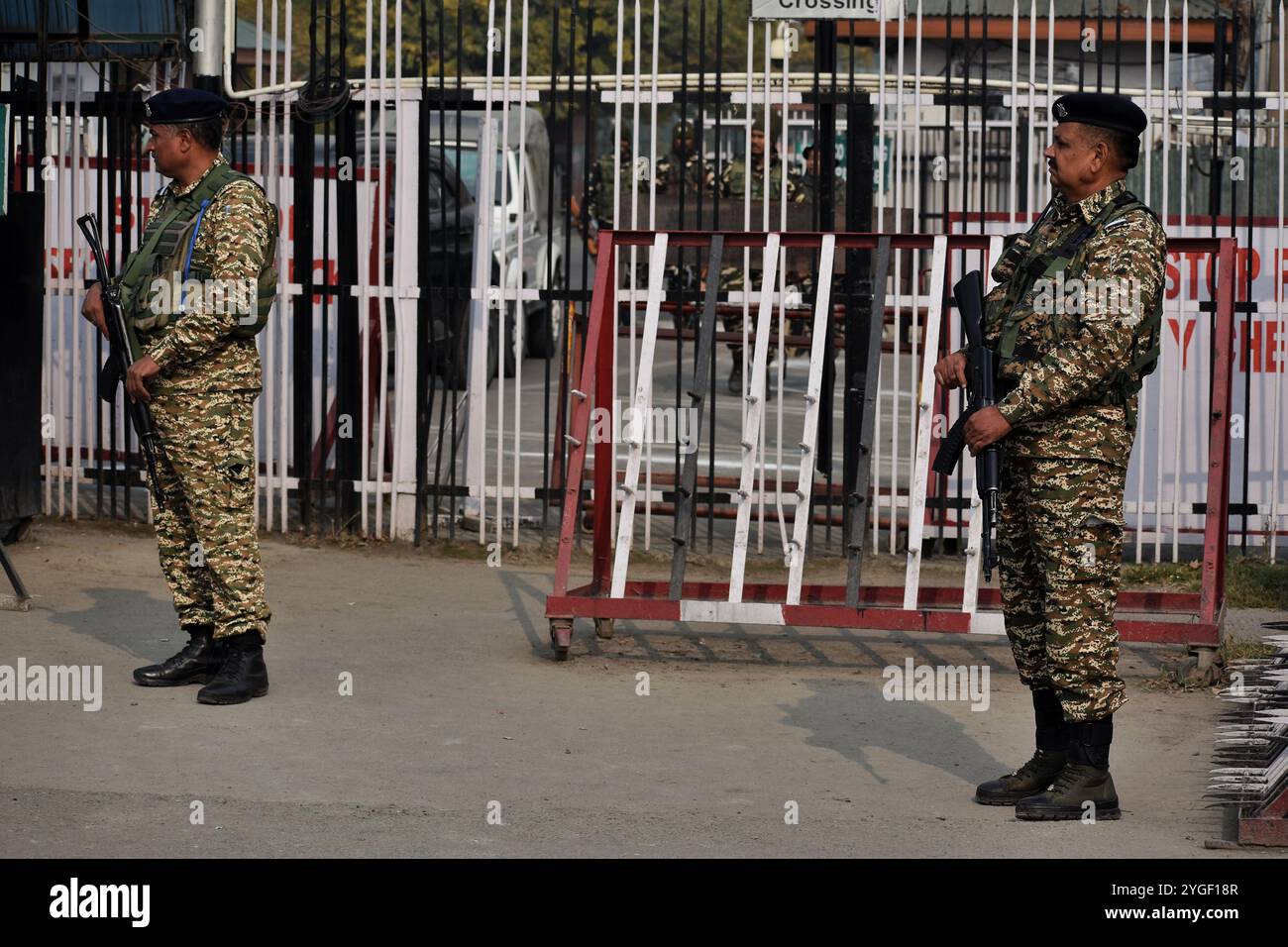 Indian security personnel stand guard outside the Jammu and Kashmir ...