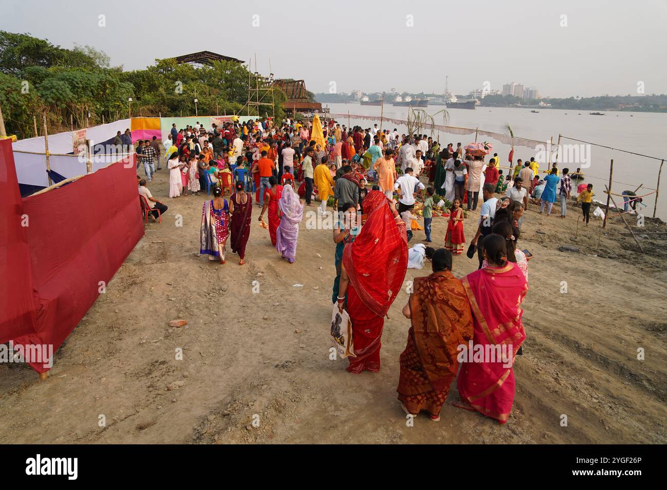 Kolkata, India - Nov 7, 2024: Hindu devotees gathered along the Hooghly ...