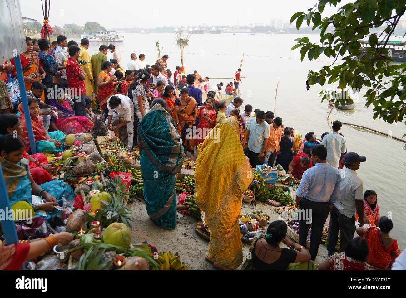 Kolkata, India - Nov 7, 2024: Hindu devotees gathered along the Hooghly ...