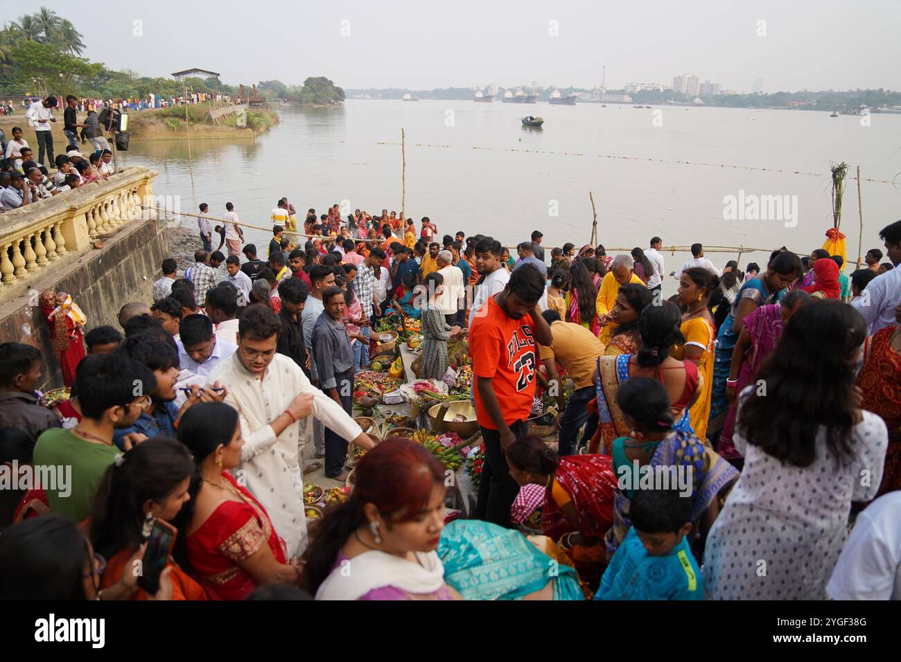 Kolkata, India - Nov 7, 2024: Hindu devotees gathered along the Hooghly ...