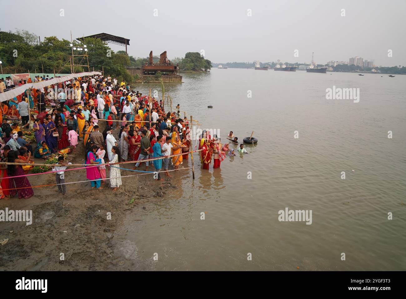 Kolkata, India - Nov 7, 2024: Hindu devotees gathered along the Hooghly ...