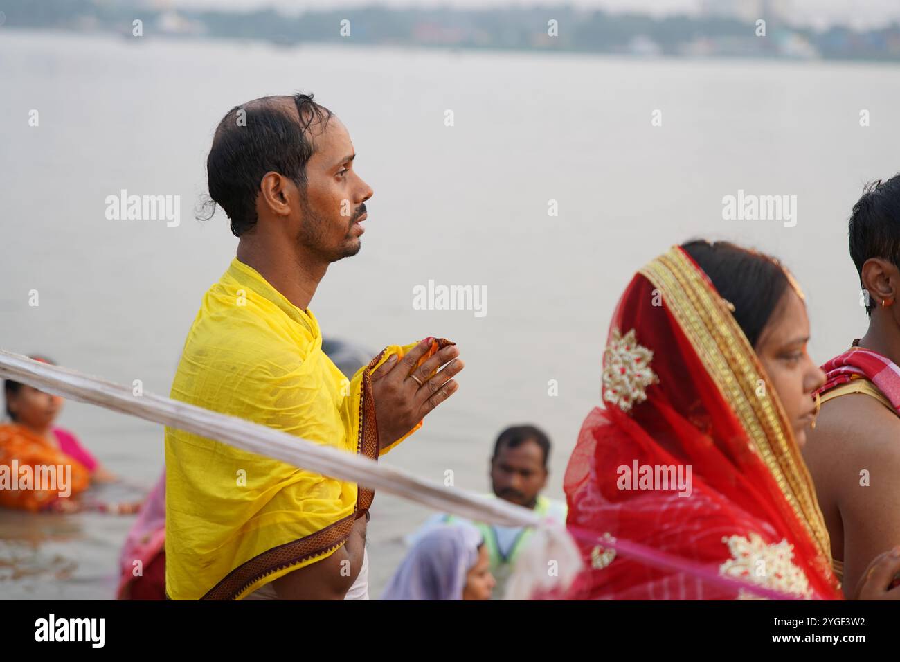 Kolkata, India - Nov 7, 2024: Hindu devotees gathered along the Hooghly ...