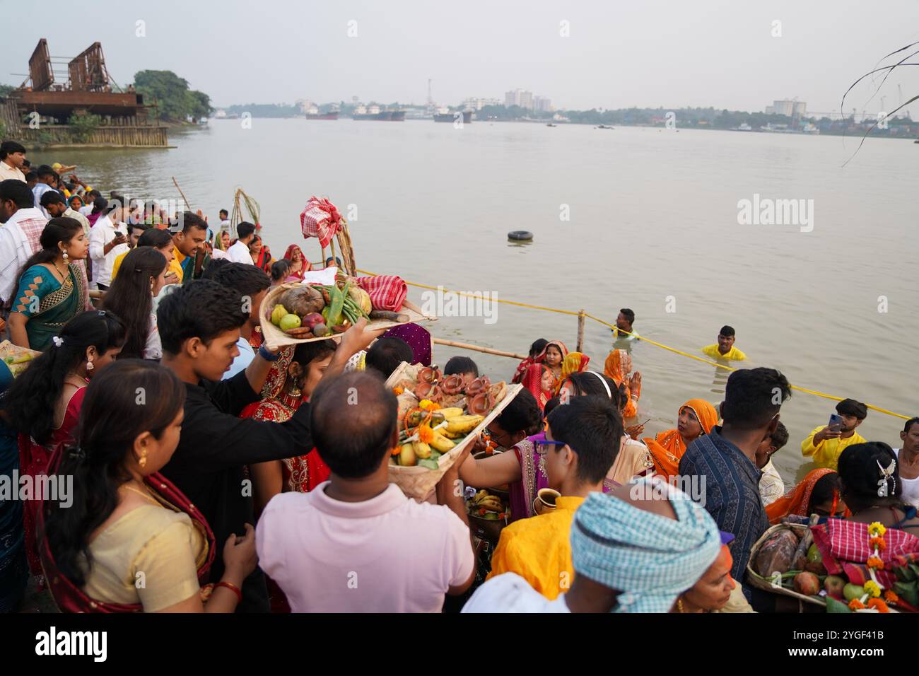 Kolkata, India - Nov 7, 2024: Hindu devotees gathered along the Hooghly ...