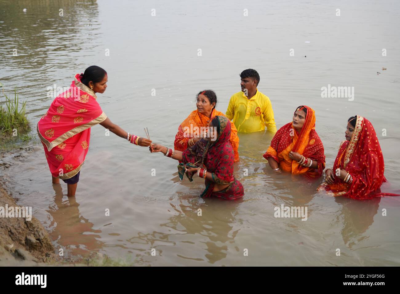 Kolkata, India - Nov 7, 2024: Hindu devotees gathered along the Hooghly ...