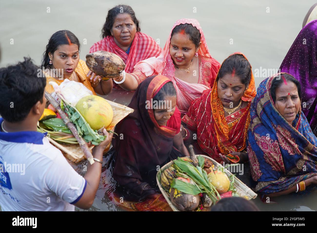 Kolkata, India - Nov 7, 2024: Hindu devotees gathered along the Hooghly ...