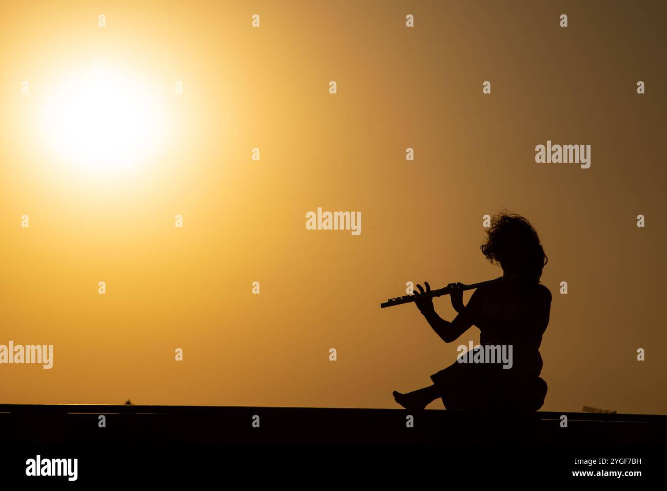 Seated flute player hi-res stock photography and images - Alamy