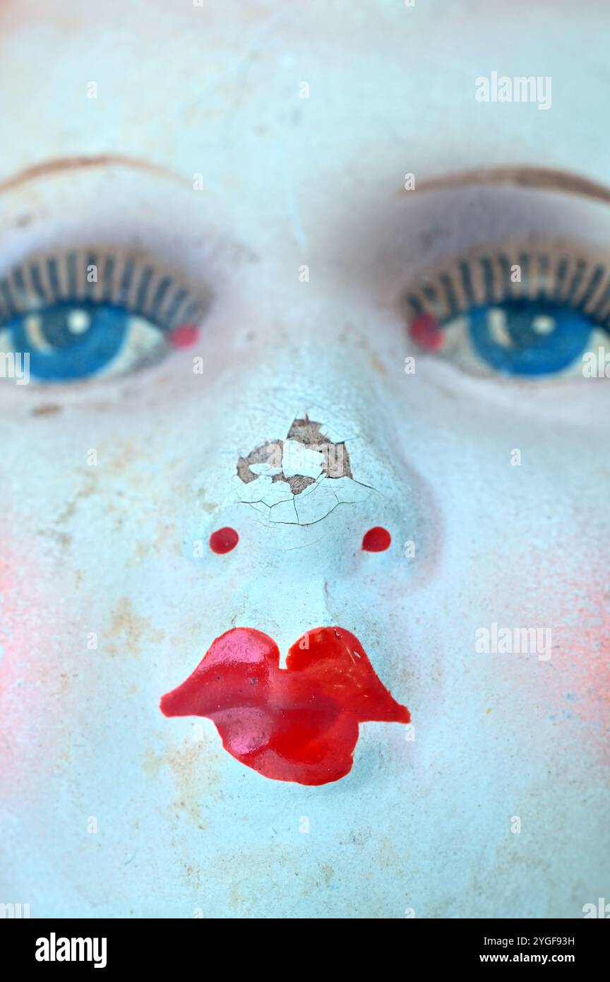 Close up of face of 1930s woman doll with blue eyes damaged nose and ...
