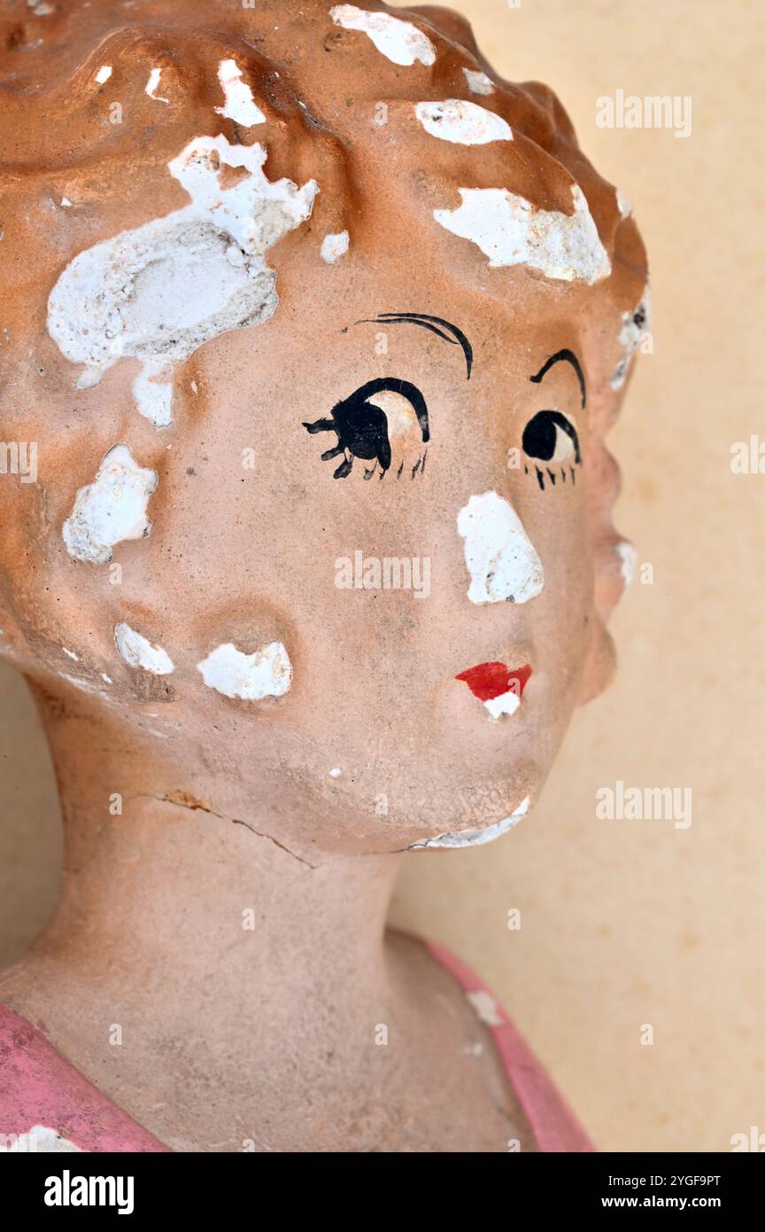 Head and shoulders of 1920s woman plaster doll with badly chipped face ...