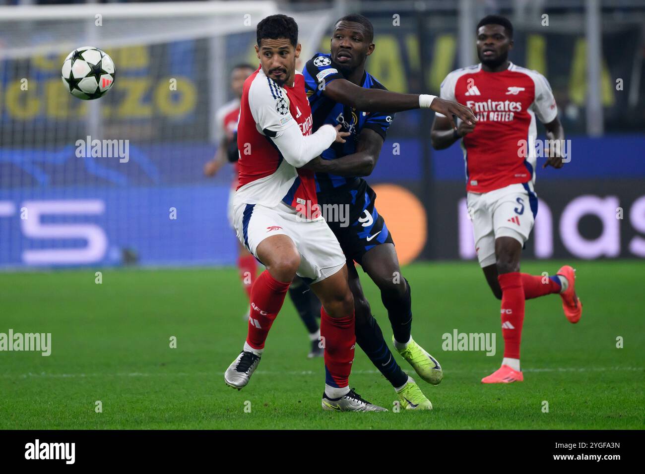 William Saliba of Arsenal FC and Marcus Thuram of FC Internazionale ...