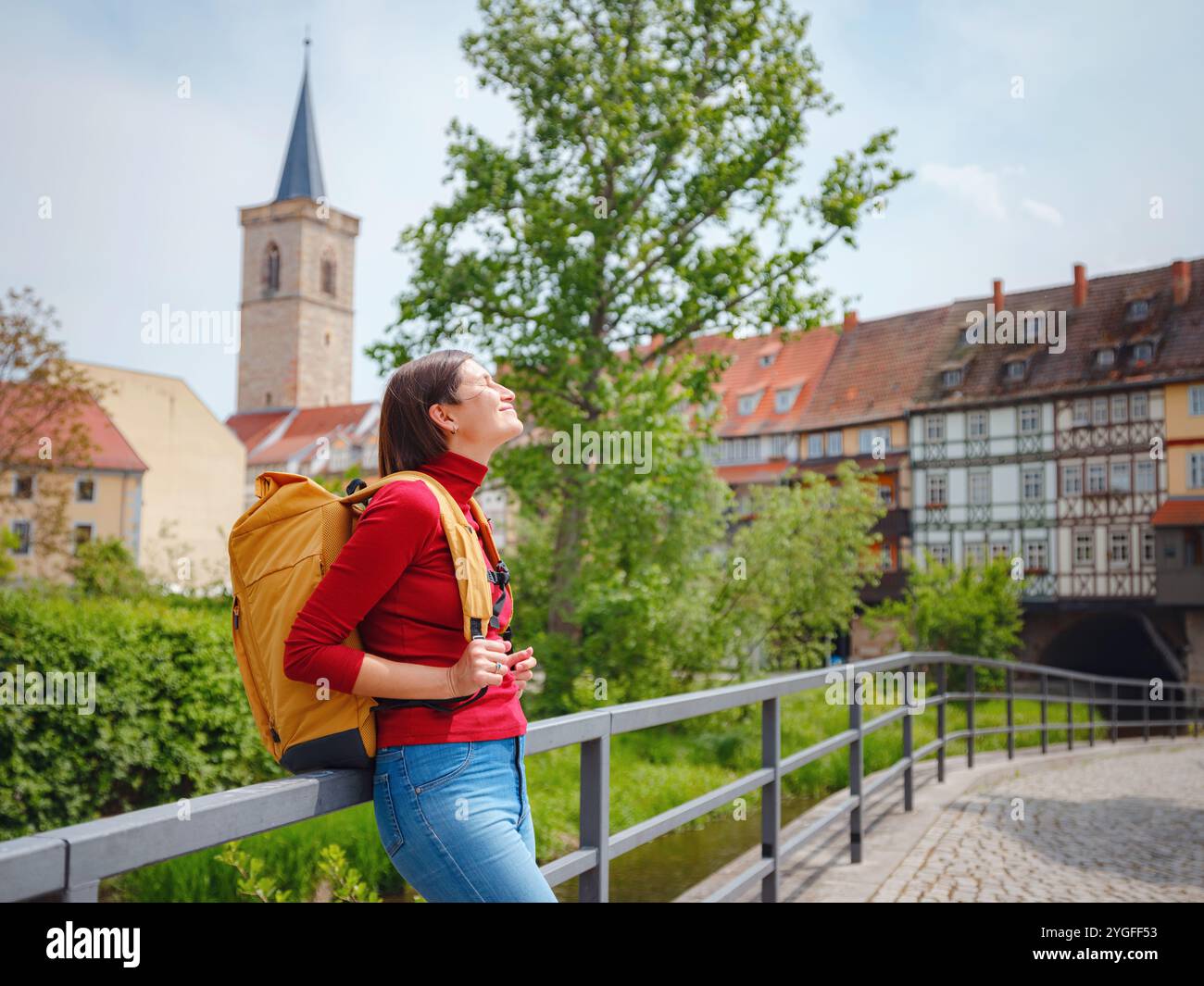 Tourist woman explores beautiful city of Erfurt, wandering through its ...