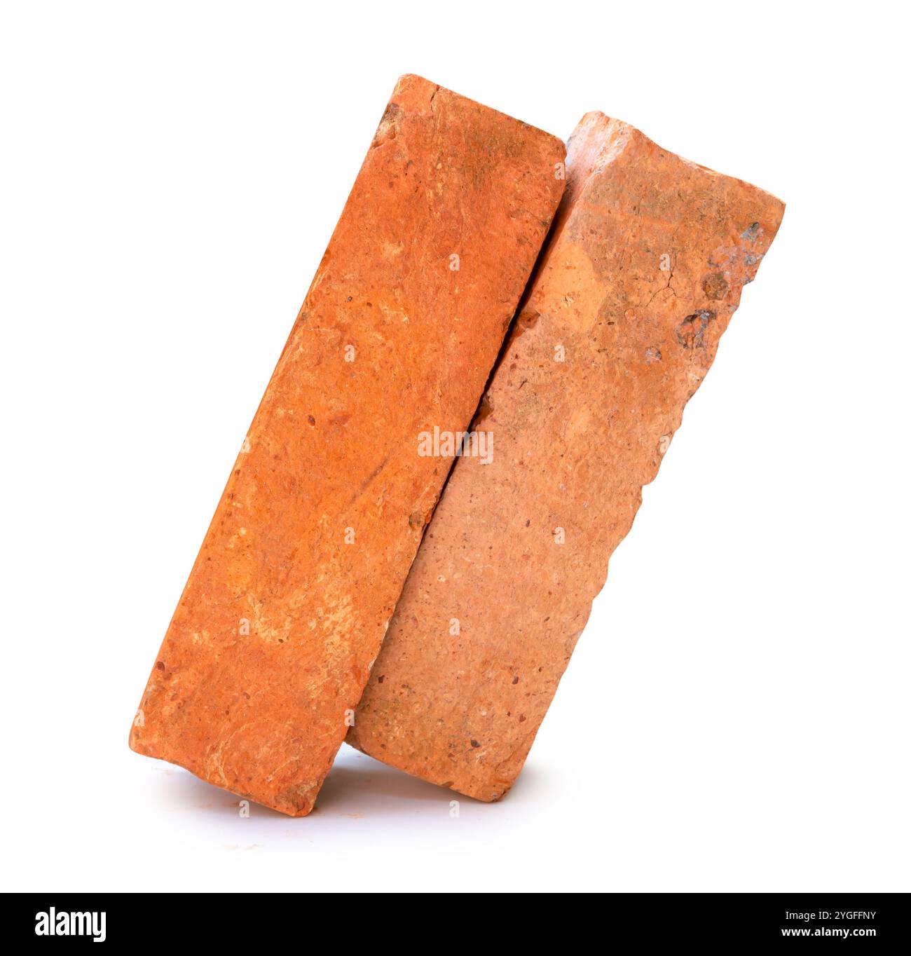 Side view of old red or orange bricks in stack are isolated on white ...