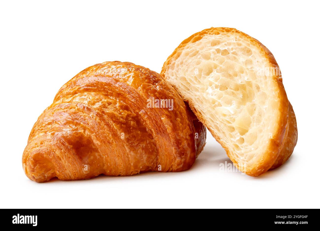 Delicious brown croissant with half in stack is isolated on white ...