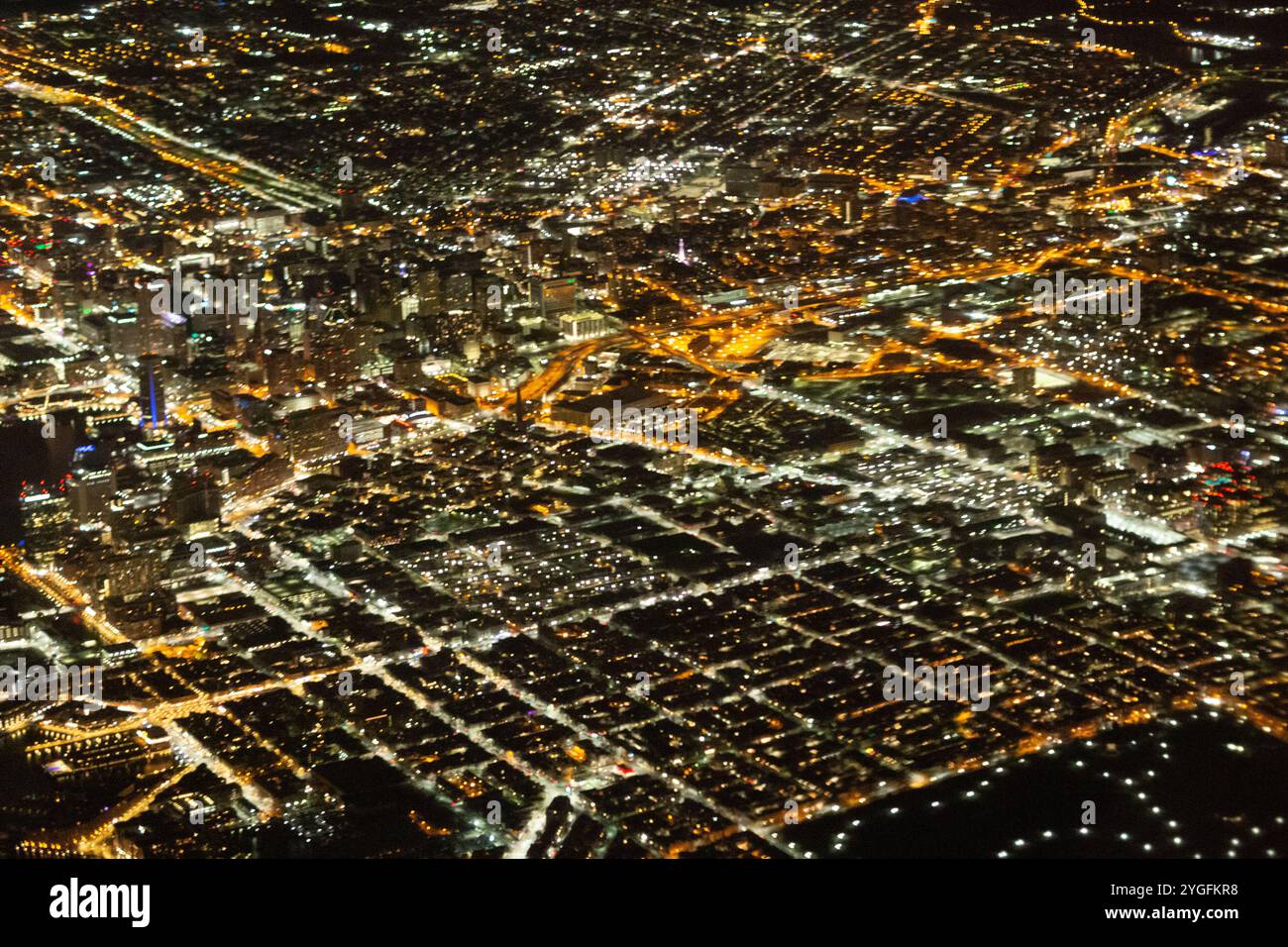 Nighttime electrical grid NYC New York aerial view showcases a ...