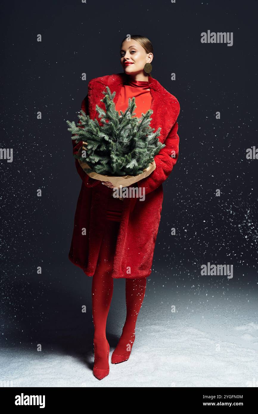 The beautiful woman radiates joy while holding a small decorated tree ...