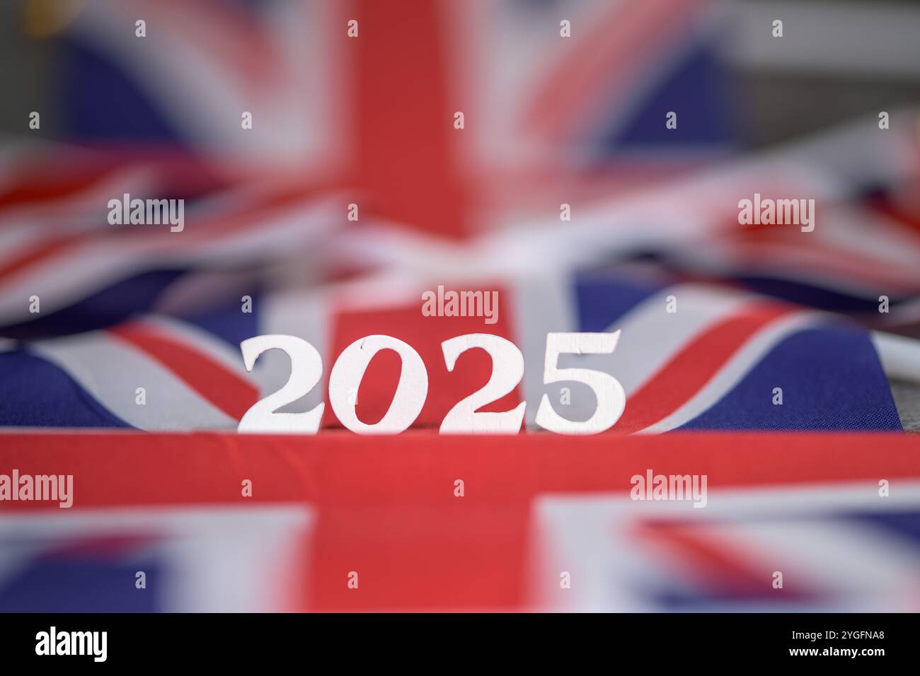 2025, wooden letters against the backdrop of the red, white and blue of ...