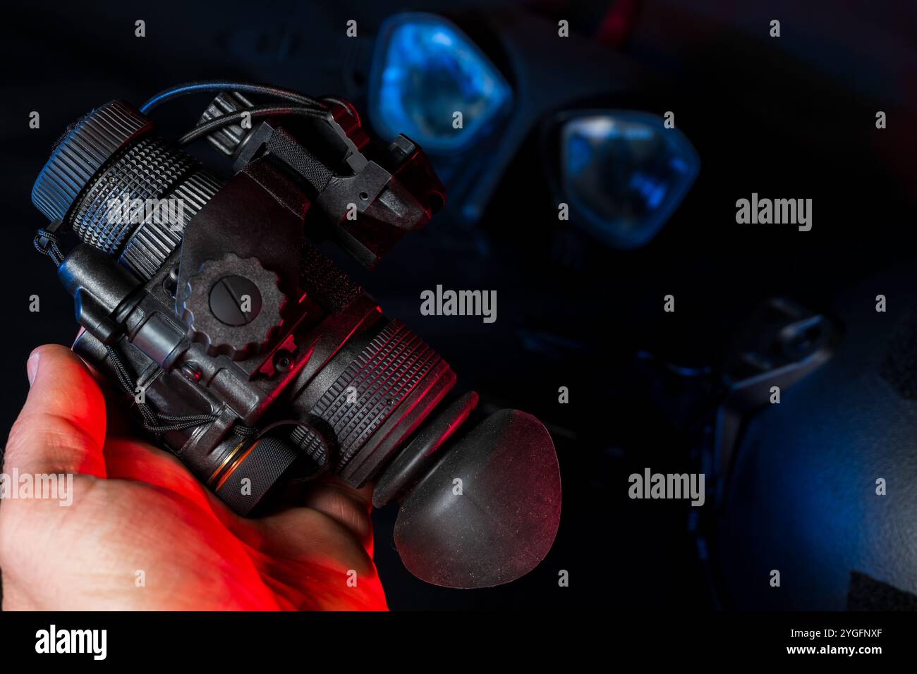 Compact military Night Vision monocular in a man's hand, close-up photo ...