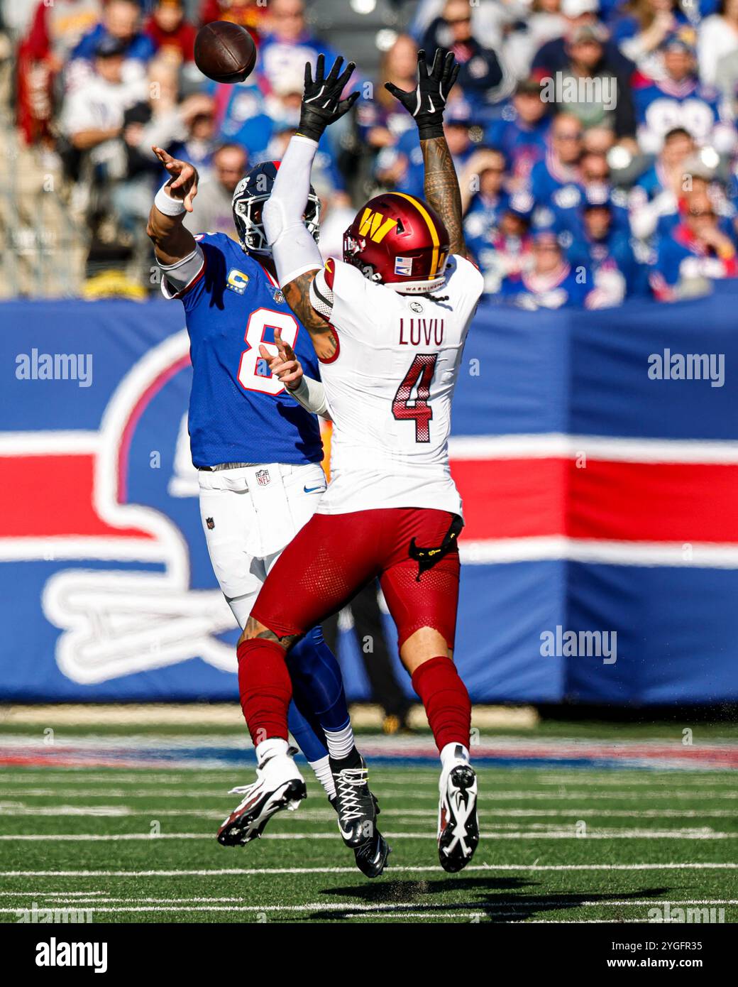 Washington Commanders linebacker Frankie Luvu (4) blocking the throw by ...