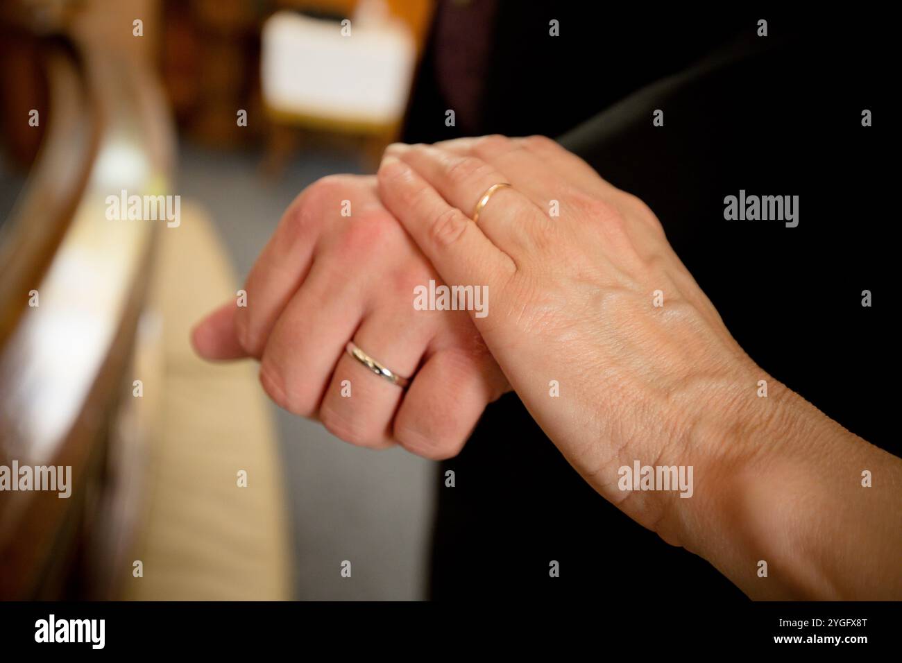 Just Married Man and Woman Hands Wearing Gold Band Rings in Church ...