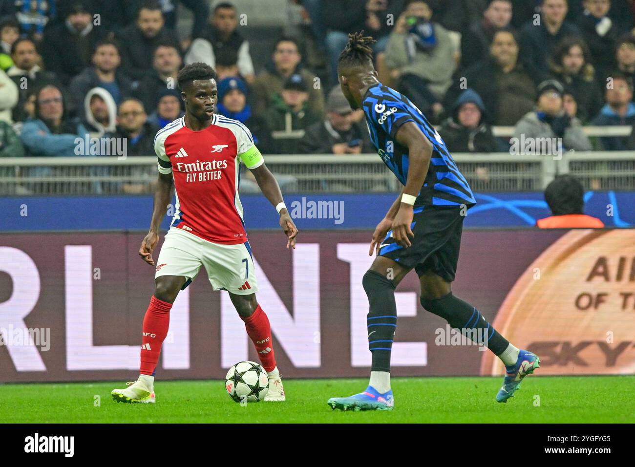 Milano, Italy. 06th Nov, 2024. Bukayo Saka of Arsenal FC (L) and Yann ...