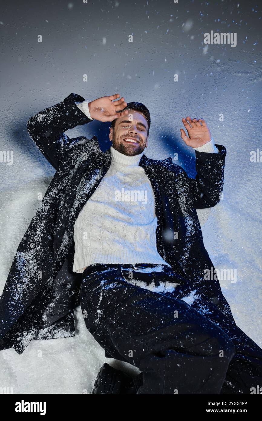 Young man smiles brightly snowflakes hi-res stock photography and ...