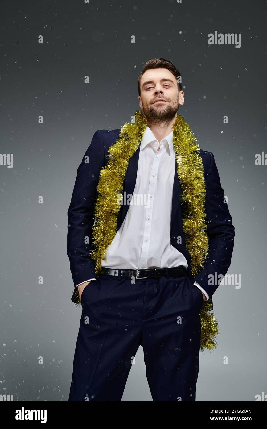 Dressed in a sharp suit, a young man poses elegantly with festive ...