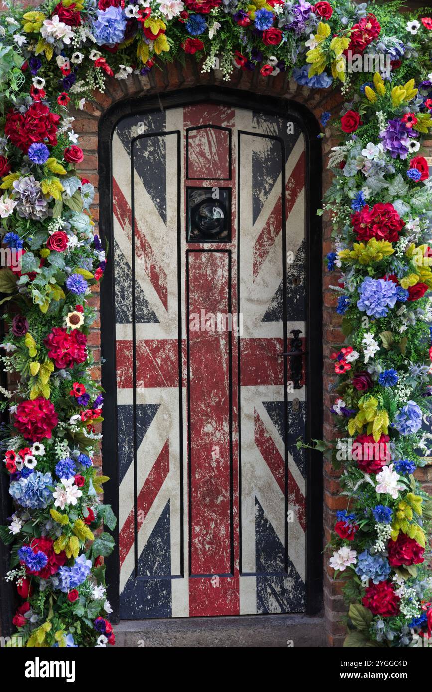 union jack door with an arch of flowers Stock Photo - Alamy
