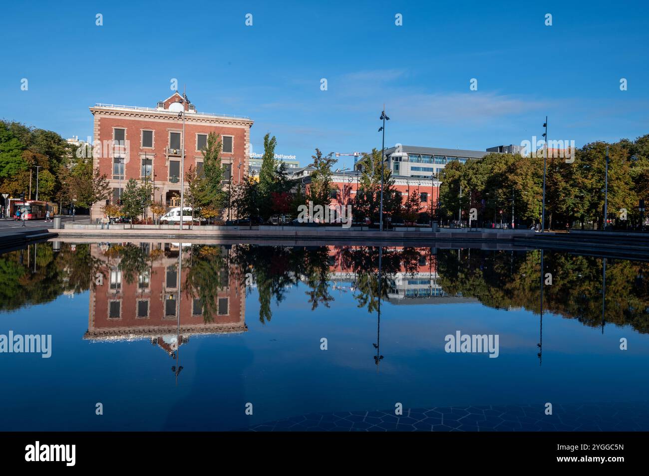 Morning reflection on a shallow ornamental pond facing the historic ...