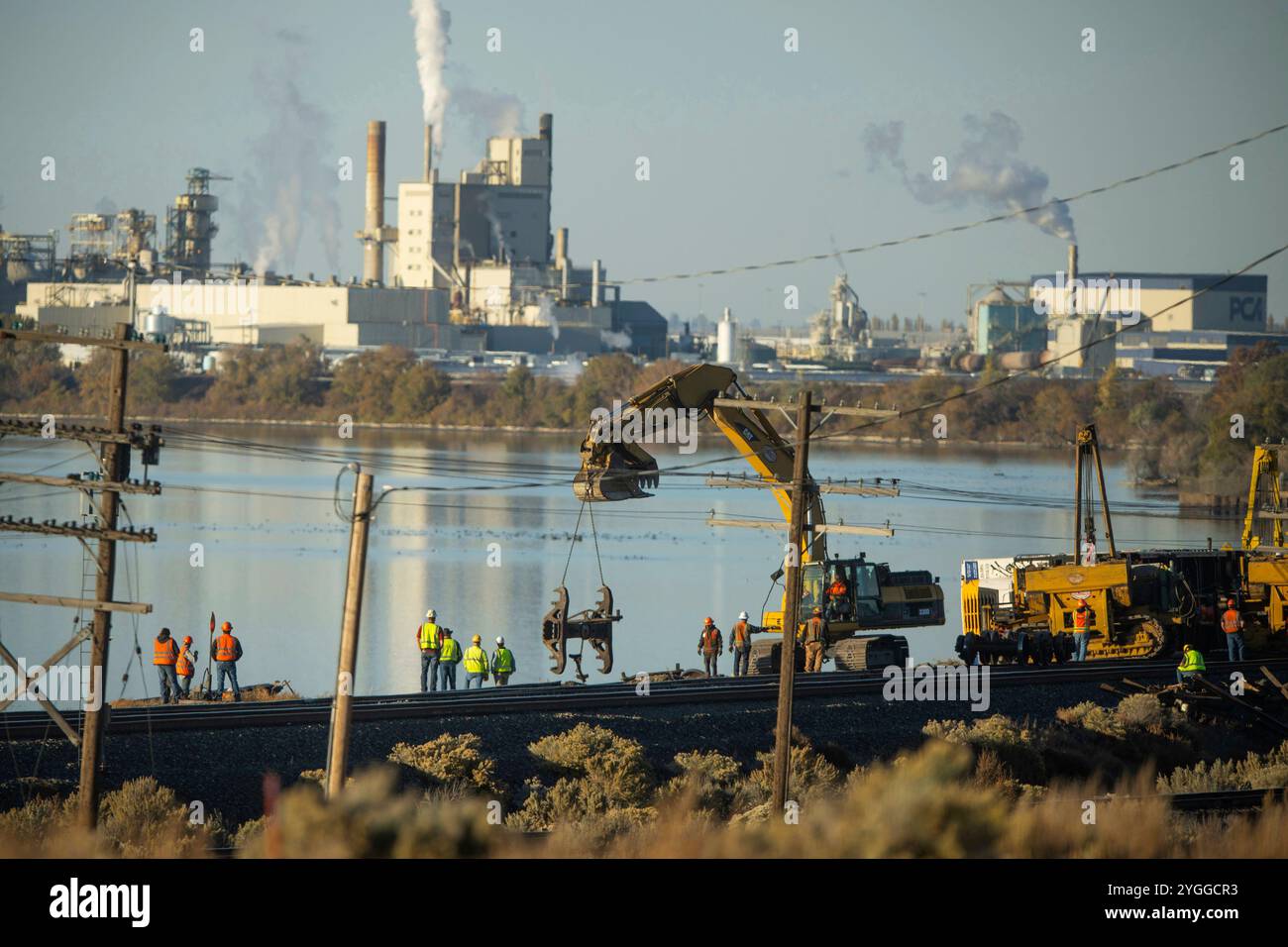 Crews work on a Union Pacific train derailment along the Columbia River ...