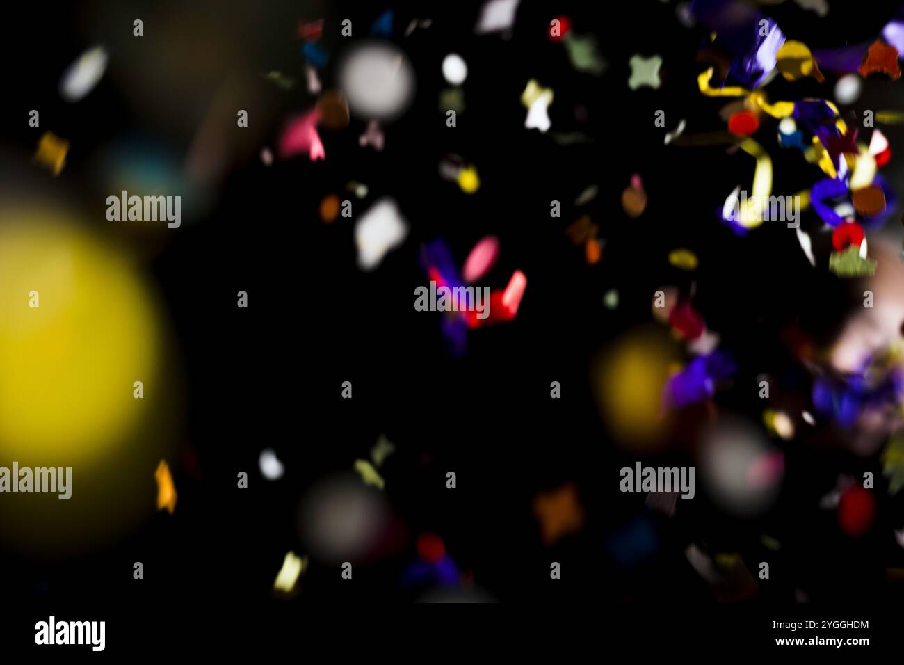 Hands throwing colorful confetti into the air during a celebration ...