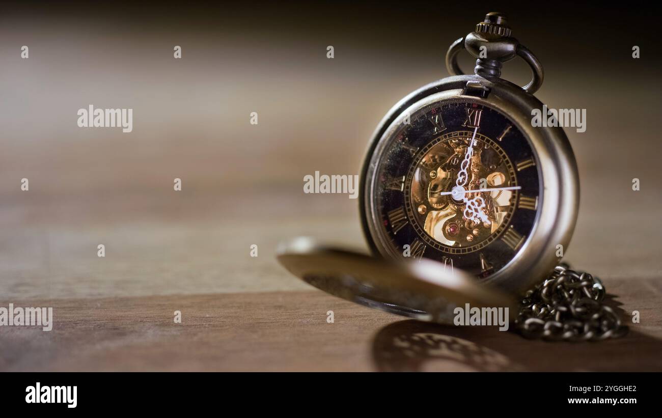 Beautiful open antique gold pocket watch ticking, on the golden ...