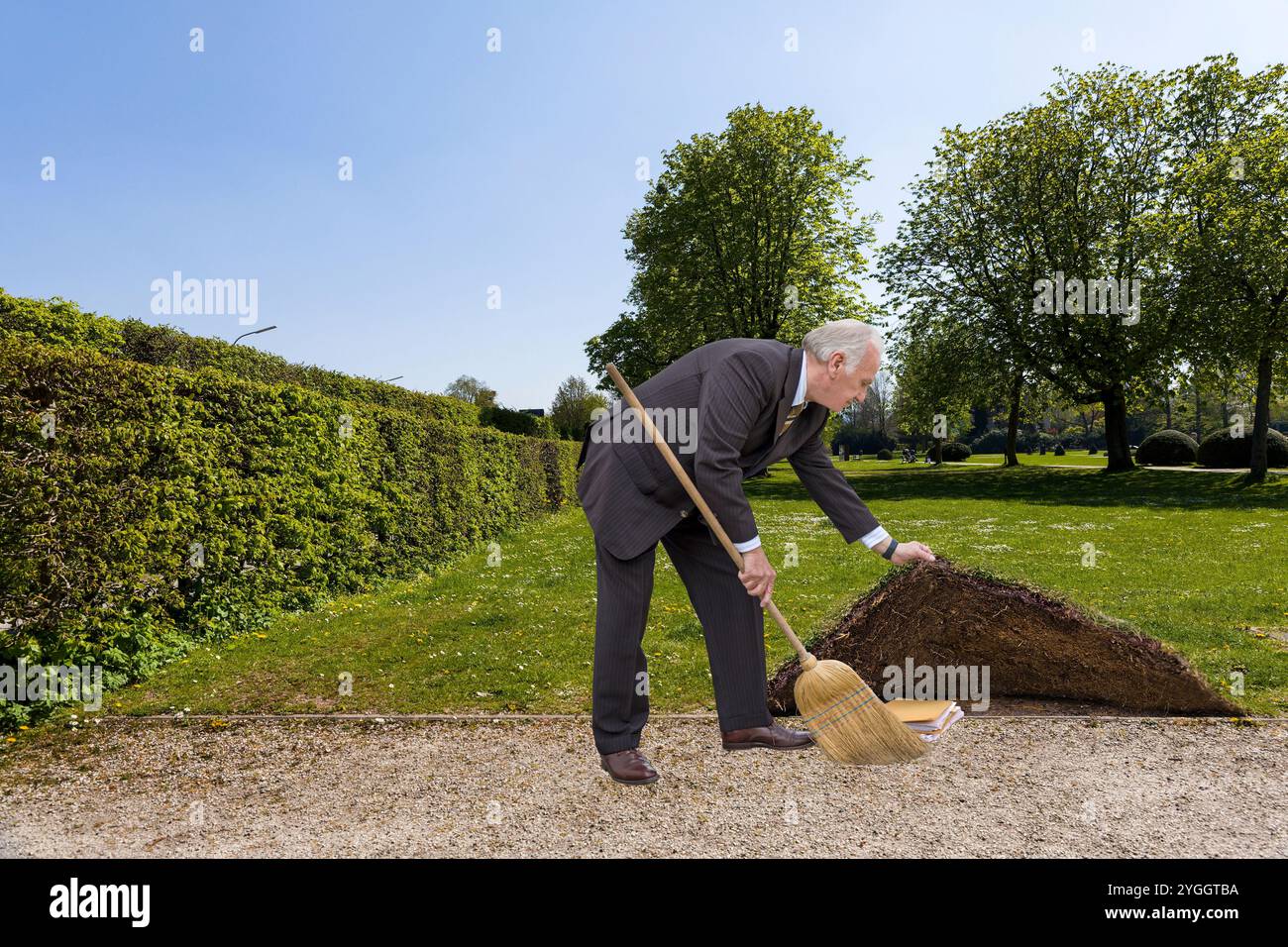 Sweeping something under the carpet Stock Photo - Alamy