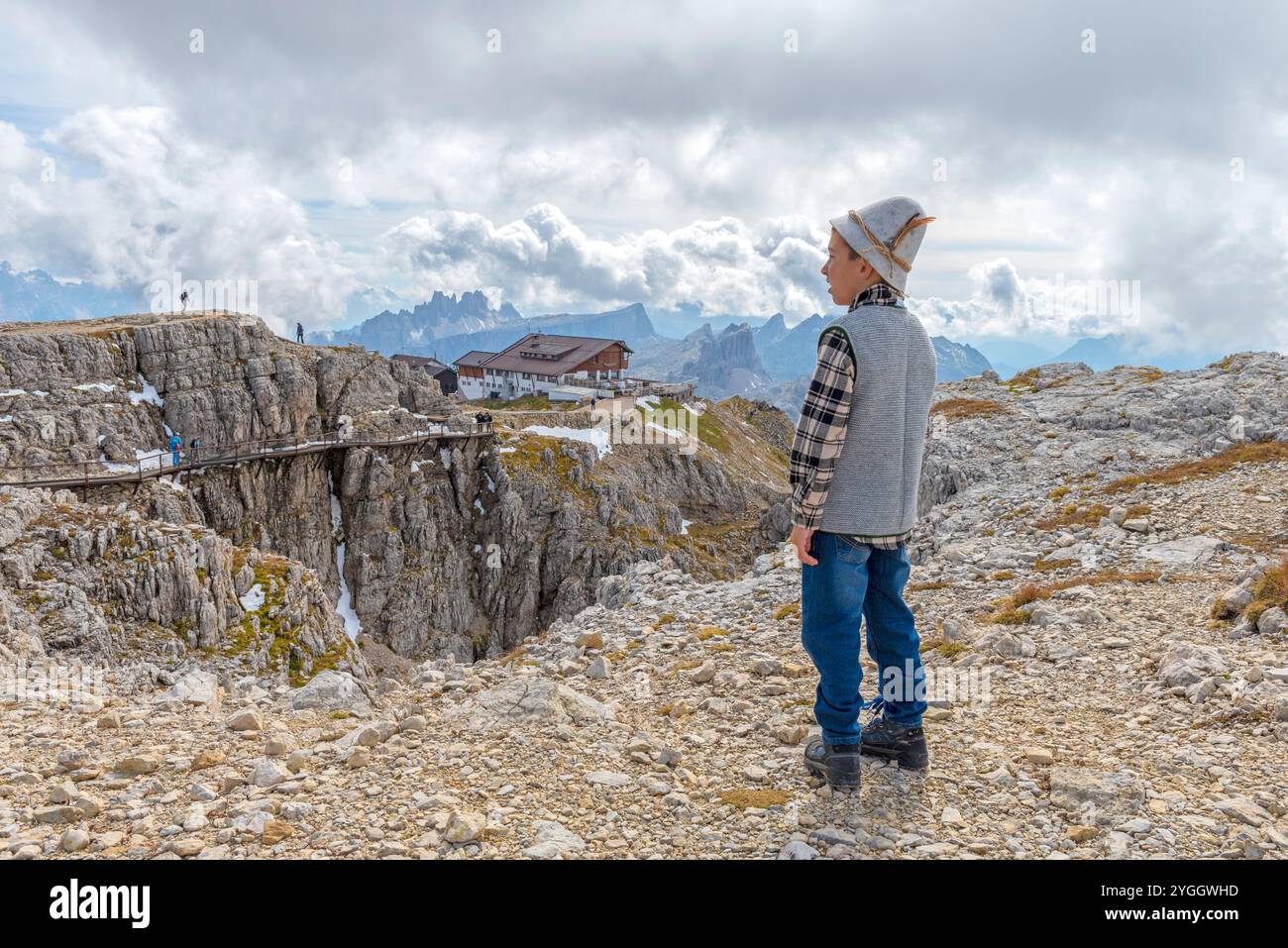 Little young Alpine soldier observing the Dolomites. Europe, Italy ...