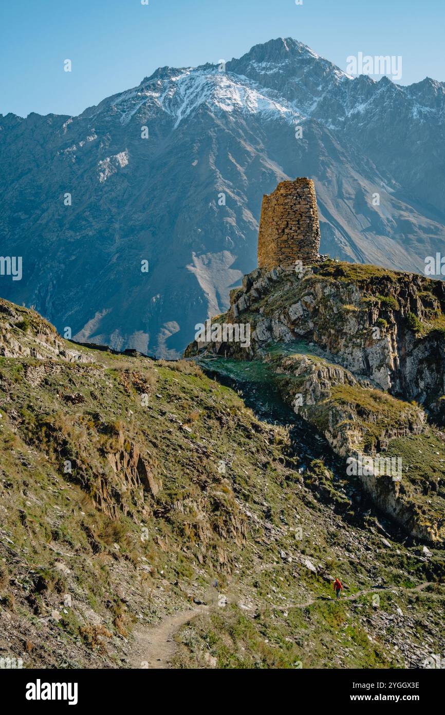 View on Gergeti medieval watchtower with the snow covered Mount Kuro in ...